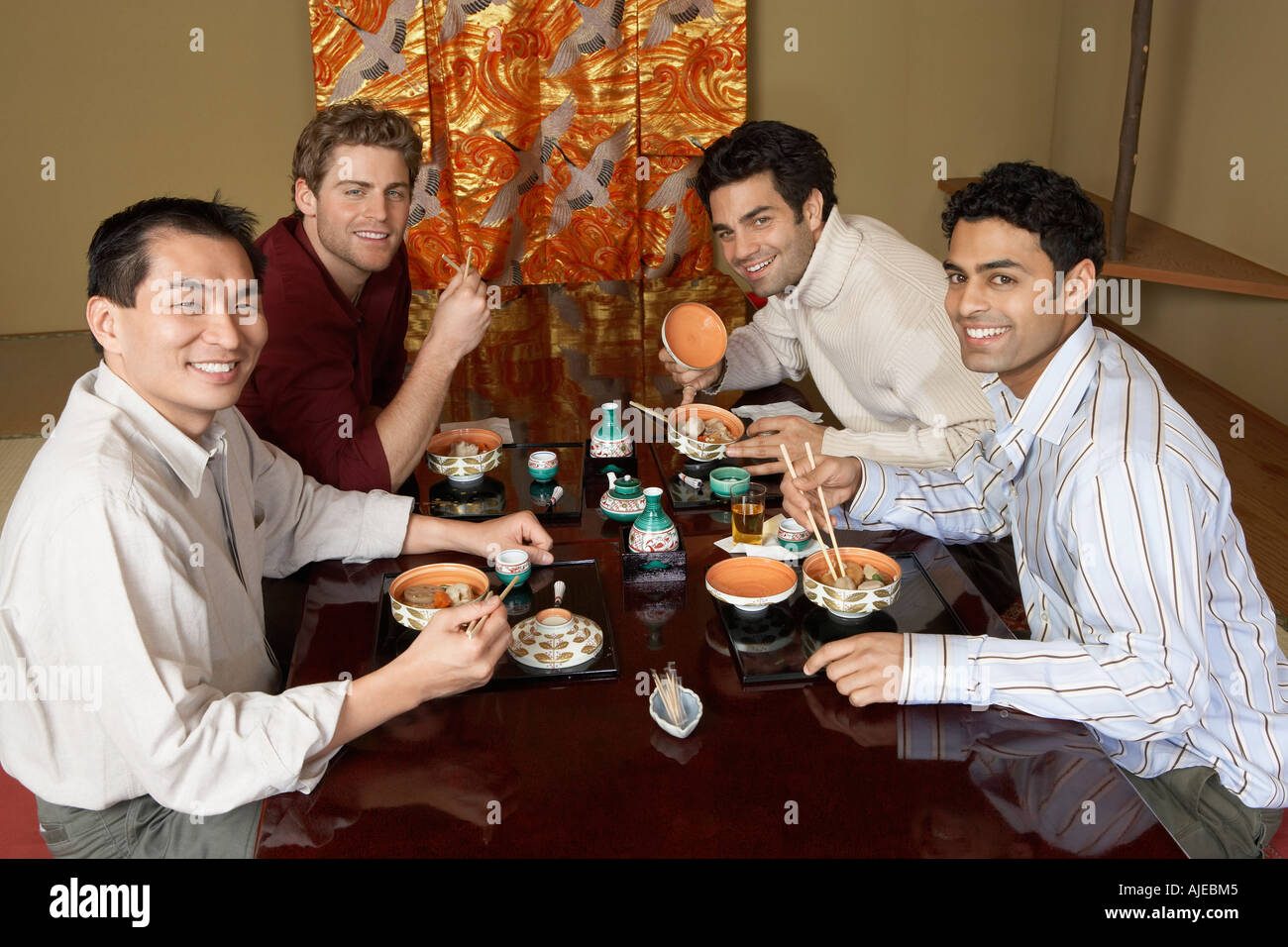 Young men eating out hi-res stock photography and images - Alamy