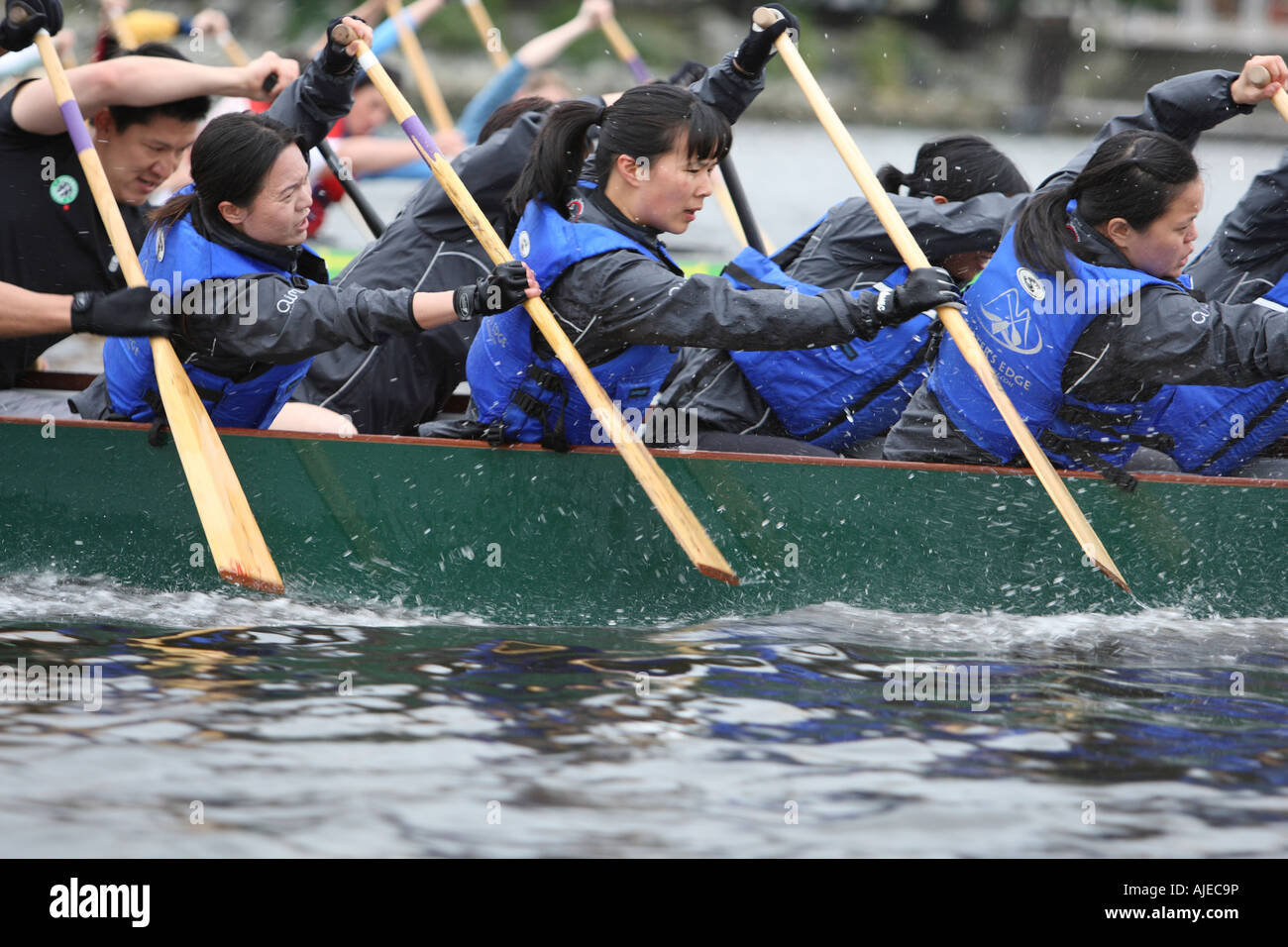 Team dragon boat racing, working together Stock Photo - Alamy