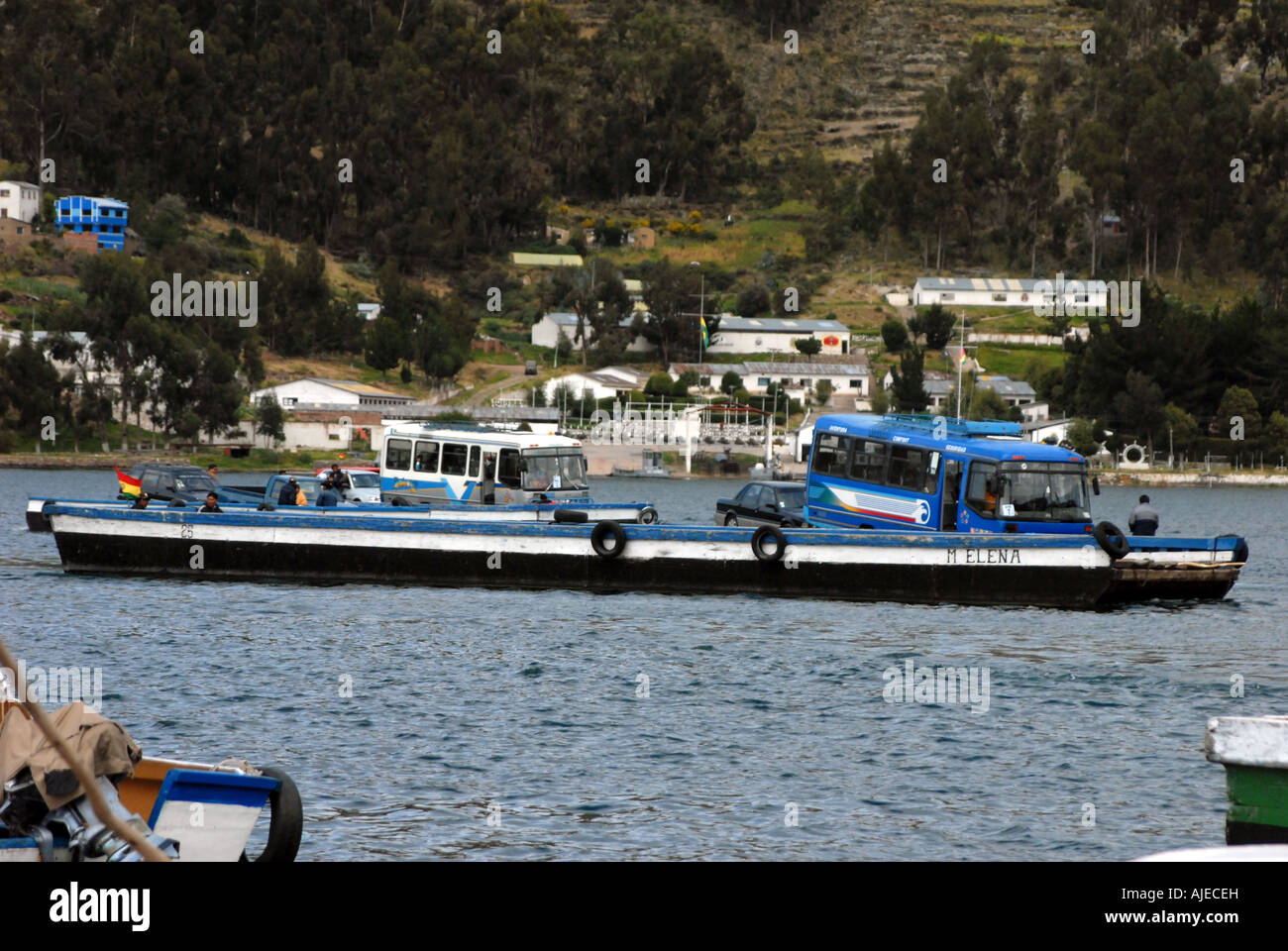 A bus is being barged across Lago Titicaca to Tiquina, Bolivia, South ...