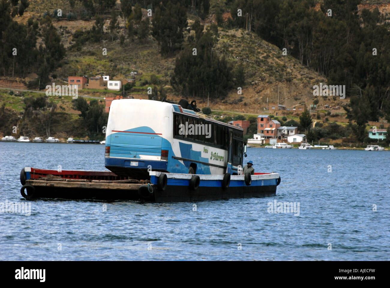 A bus is being barged across Lago Titicaca to Tiquina, Bolivia, South ...