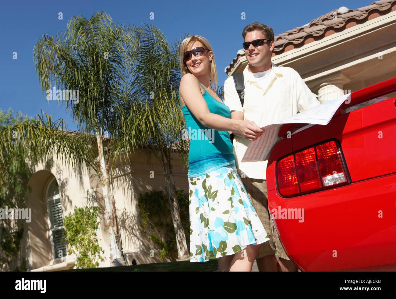 Couple outside house car hi-res stock photography and images - Alamy