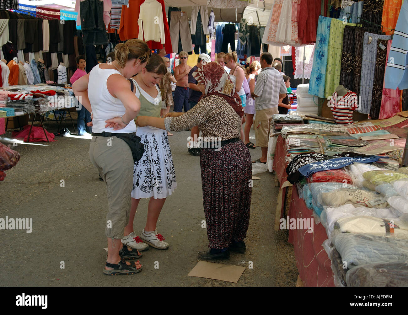 Two women shop for clothes in a market in Turkey Stock Photo - Alamy