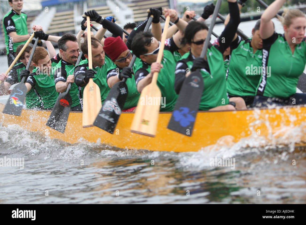 Team dragon boat racing, working together Stock Photo - Alamy