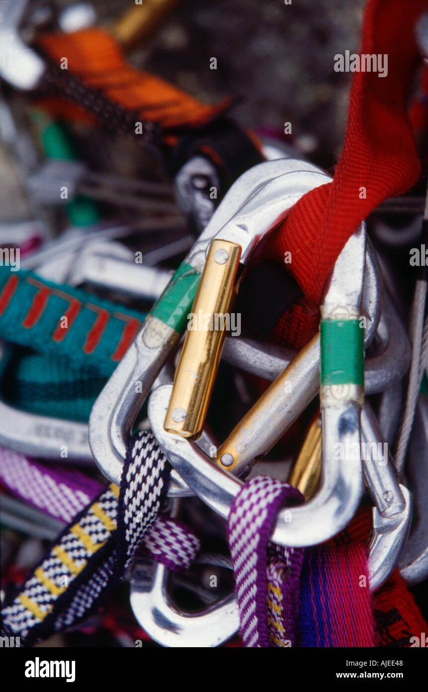 A bunch of colourful climbing shackles and equipment on a climbers belt ...