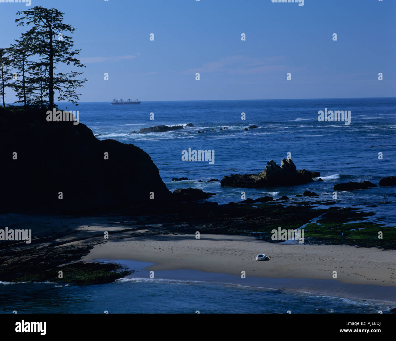 Sunset Bay State Park Southern Oregon Coast with raft on deserted beach ...