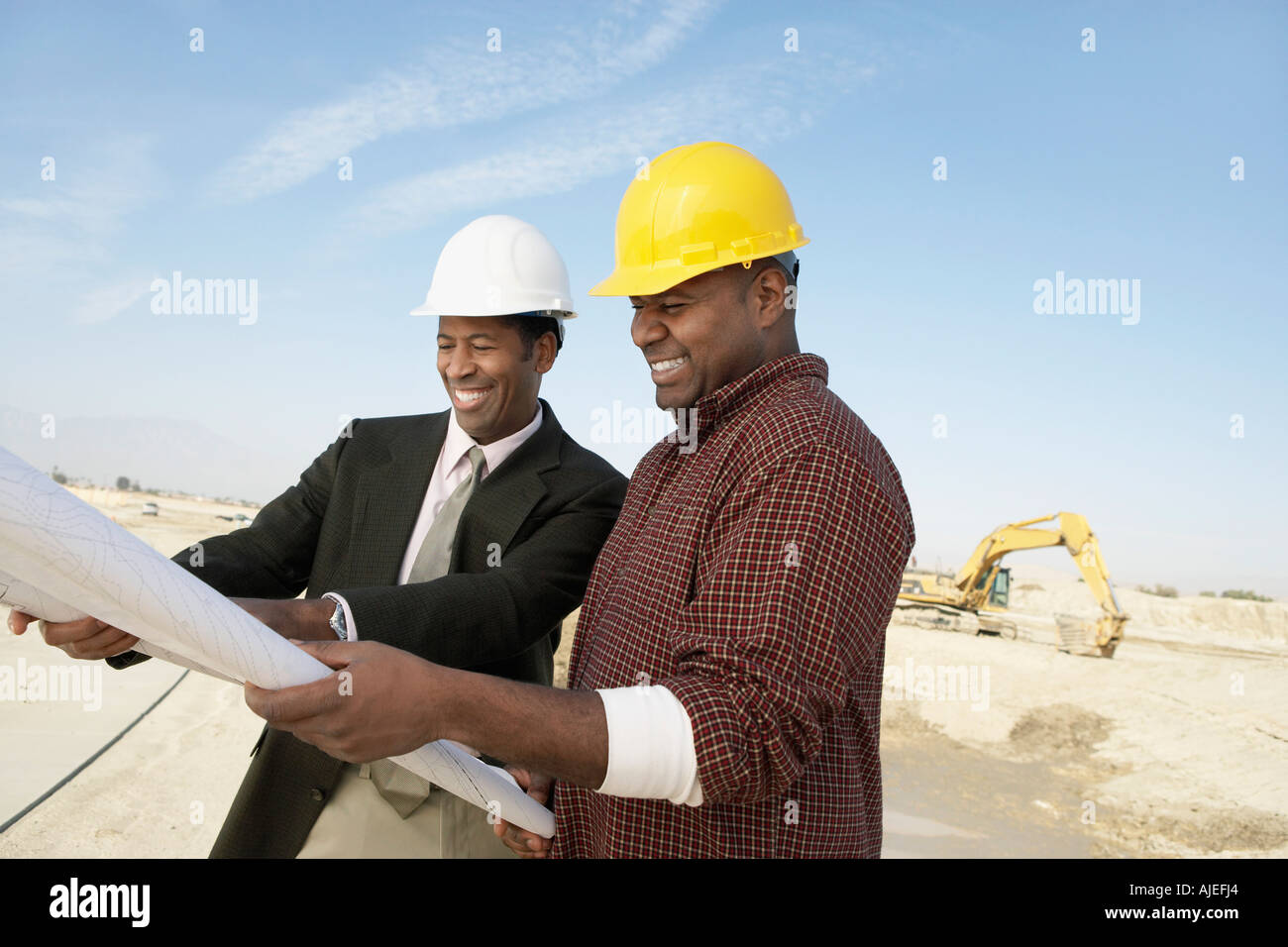 Construction workers wearing hard hats hi-res stock photography and ...