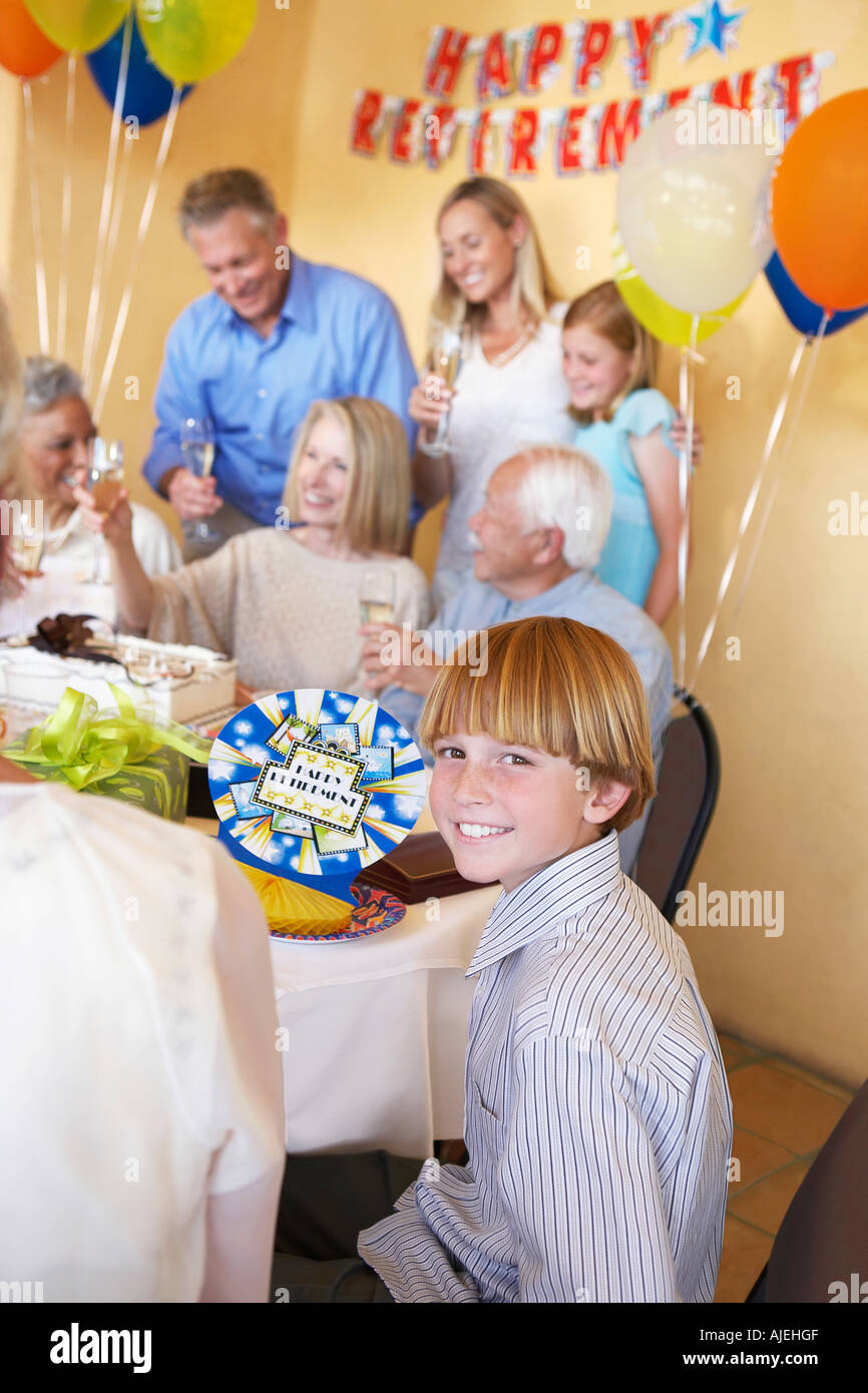 Young boy smiling, Family Having a retirement Party Stock Photo - Alamy