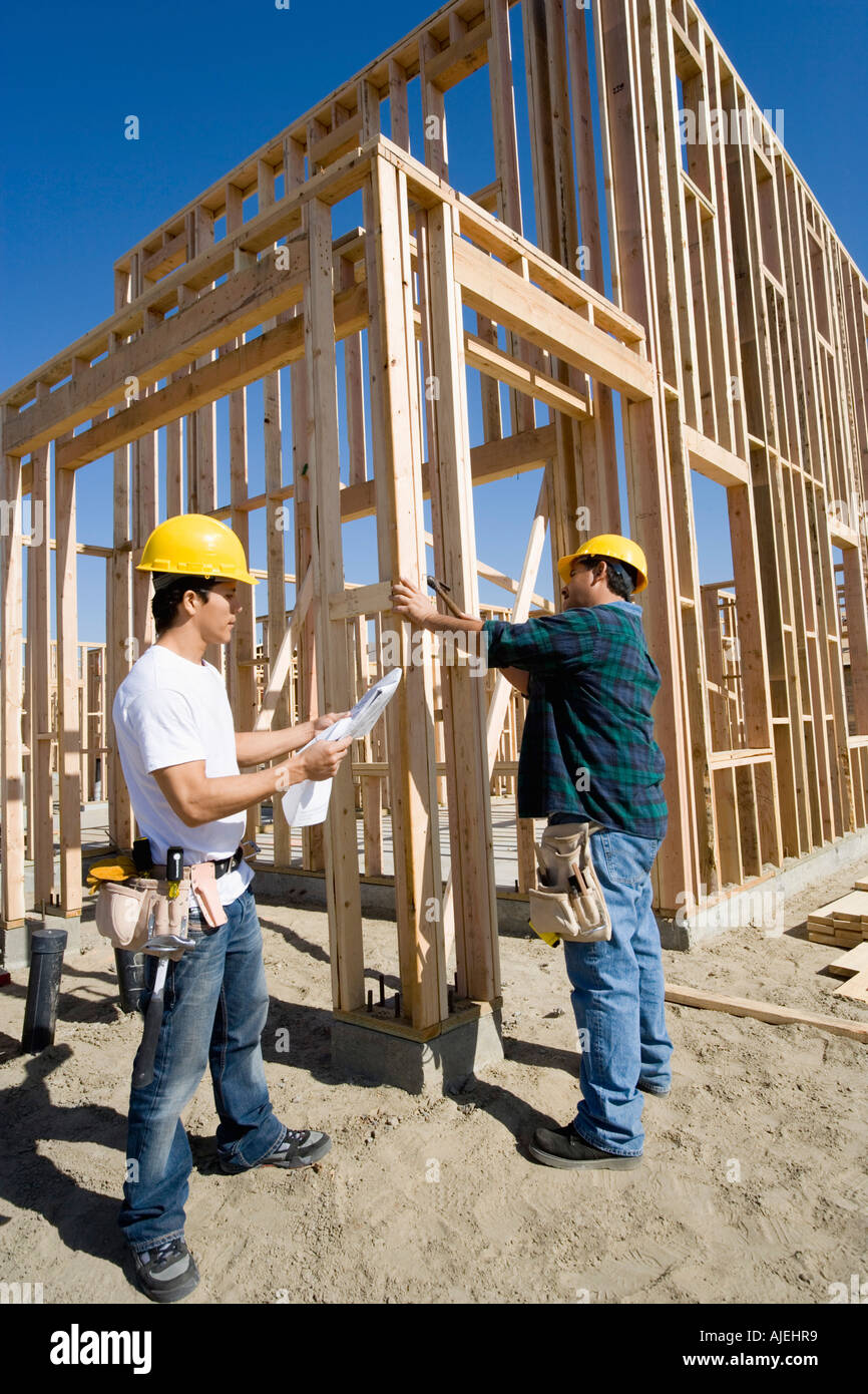 Two construction workers at construction site Stock Photo - Alamy