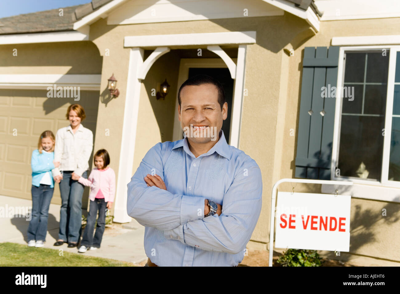 Family standing in front of house hi-res stock photography and images ...
