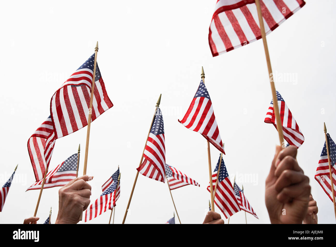 People holding up American Flags, High Section Stock Photo - Alamy