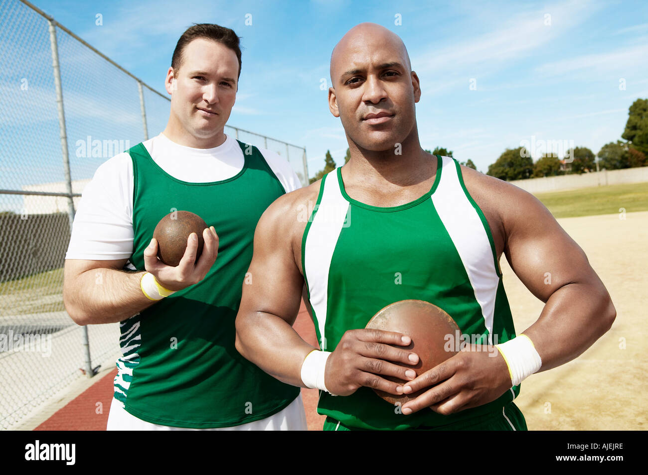 Shot Putters holding shot put and discus, half length Stock Photo - Alamy