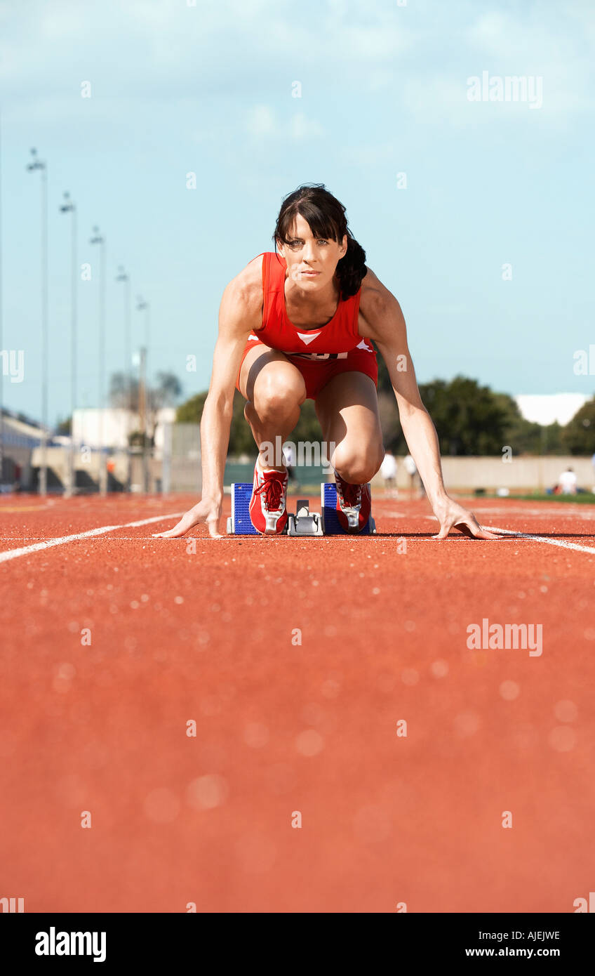 Runner crouching starting block hi-res stock photography and images - Alamy