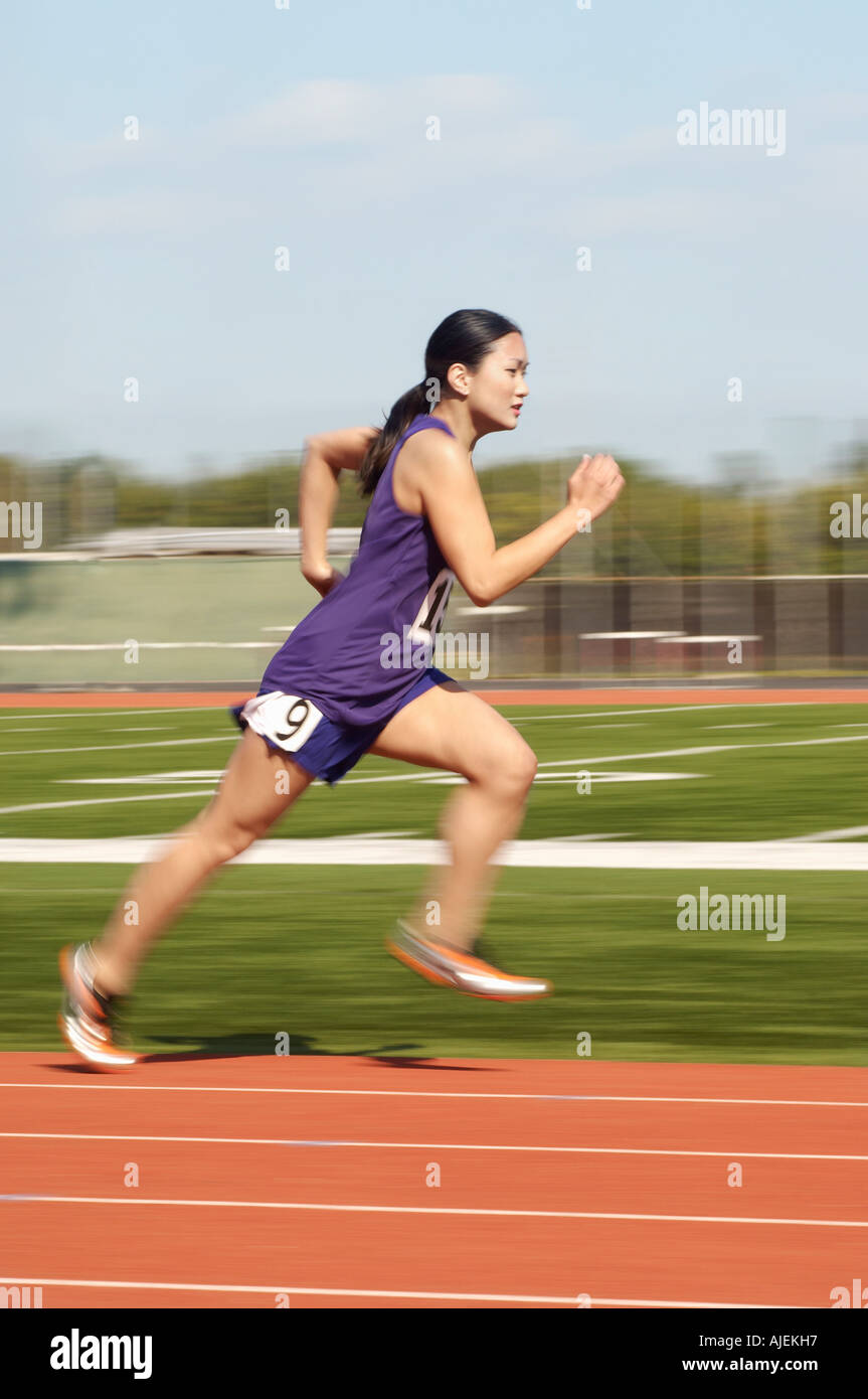 Female athlete running, side view Stock Photo - Alamy