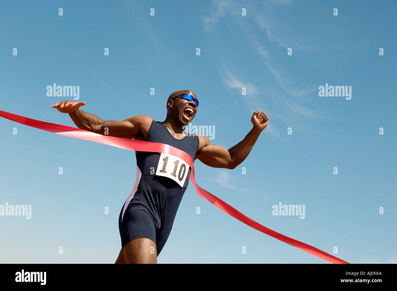 Male runner winning race Stock Photo - Alamy