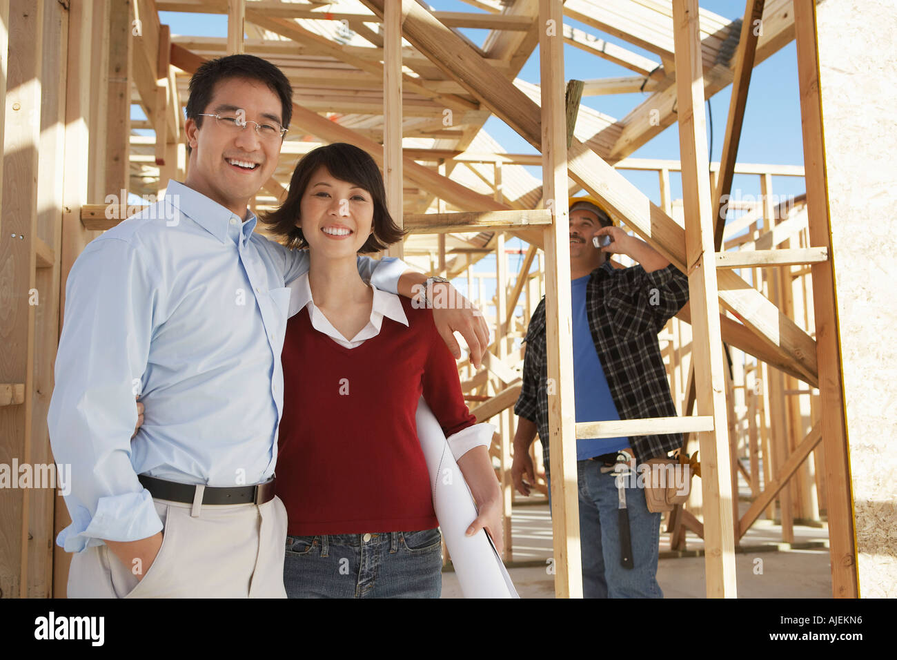 Couple on new home building site Stock Photo - Alamy
