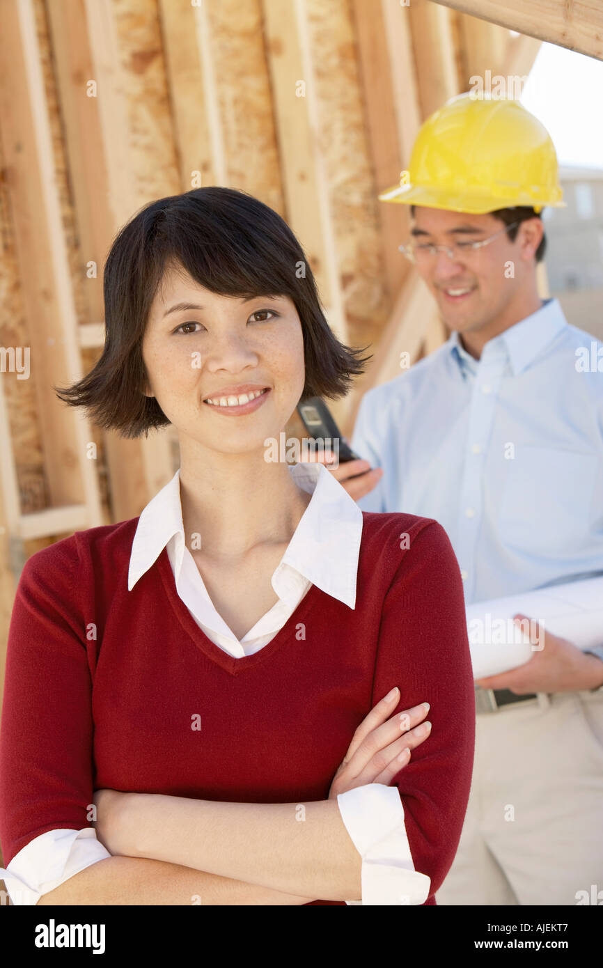 Woman in front of house being built Stock Photo - Alamy