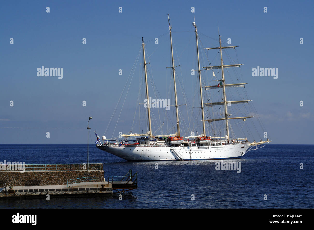Four Masted Schooner moored offshore from the Harbour of Marina Corta ...