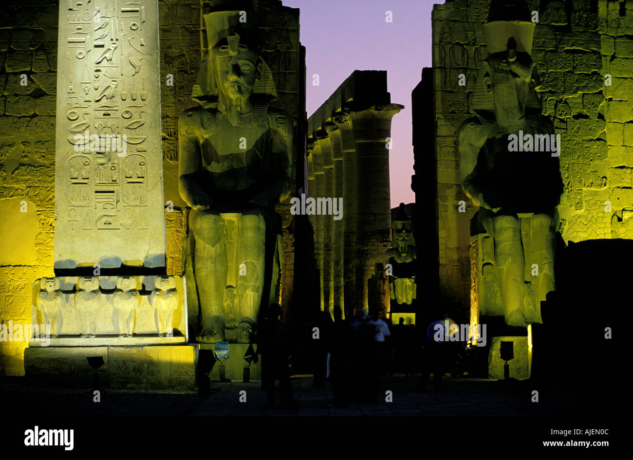 Obelisk and statue of Ramses II at Luxor temple Stock Photo - Alamy