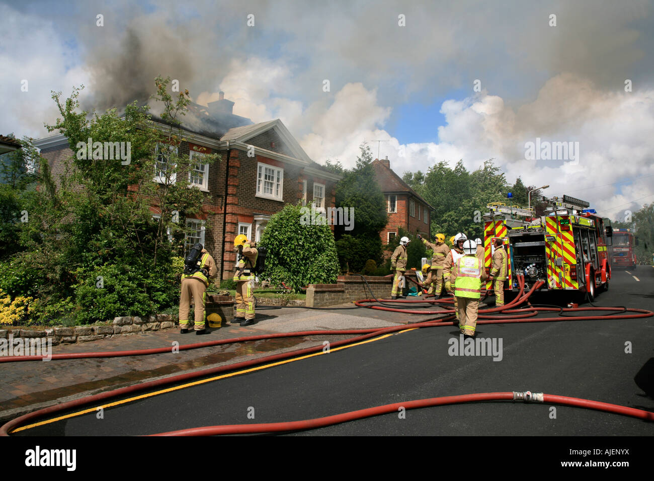 Firemen putting out house fire hi-res stock photography and images - Alamy