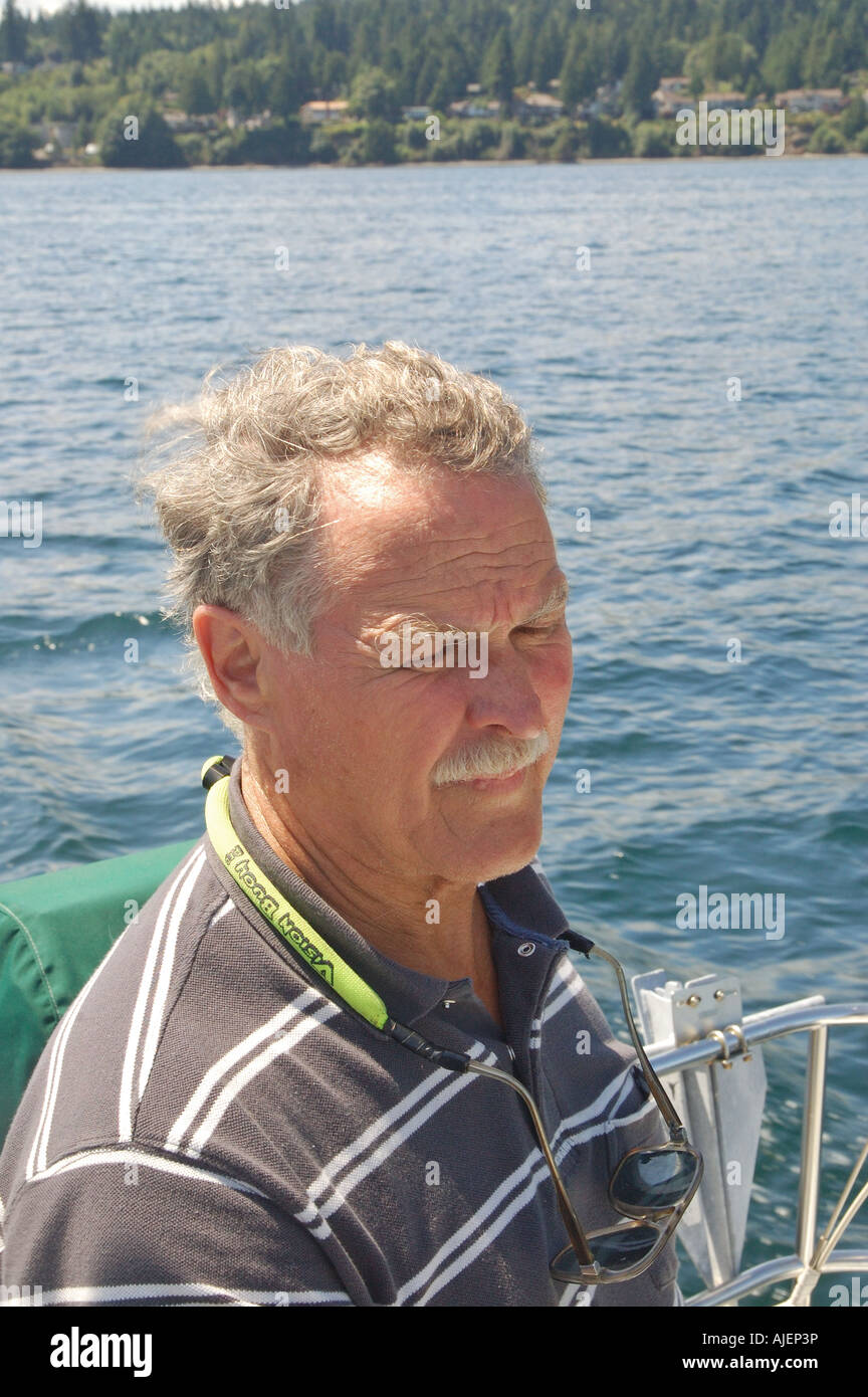Retired man on his sailboat in the Puget Sound Stock Photo - Alamy