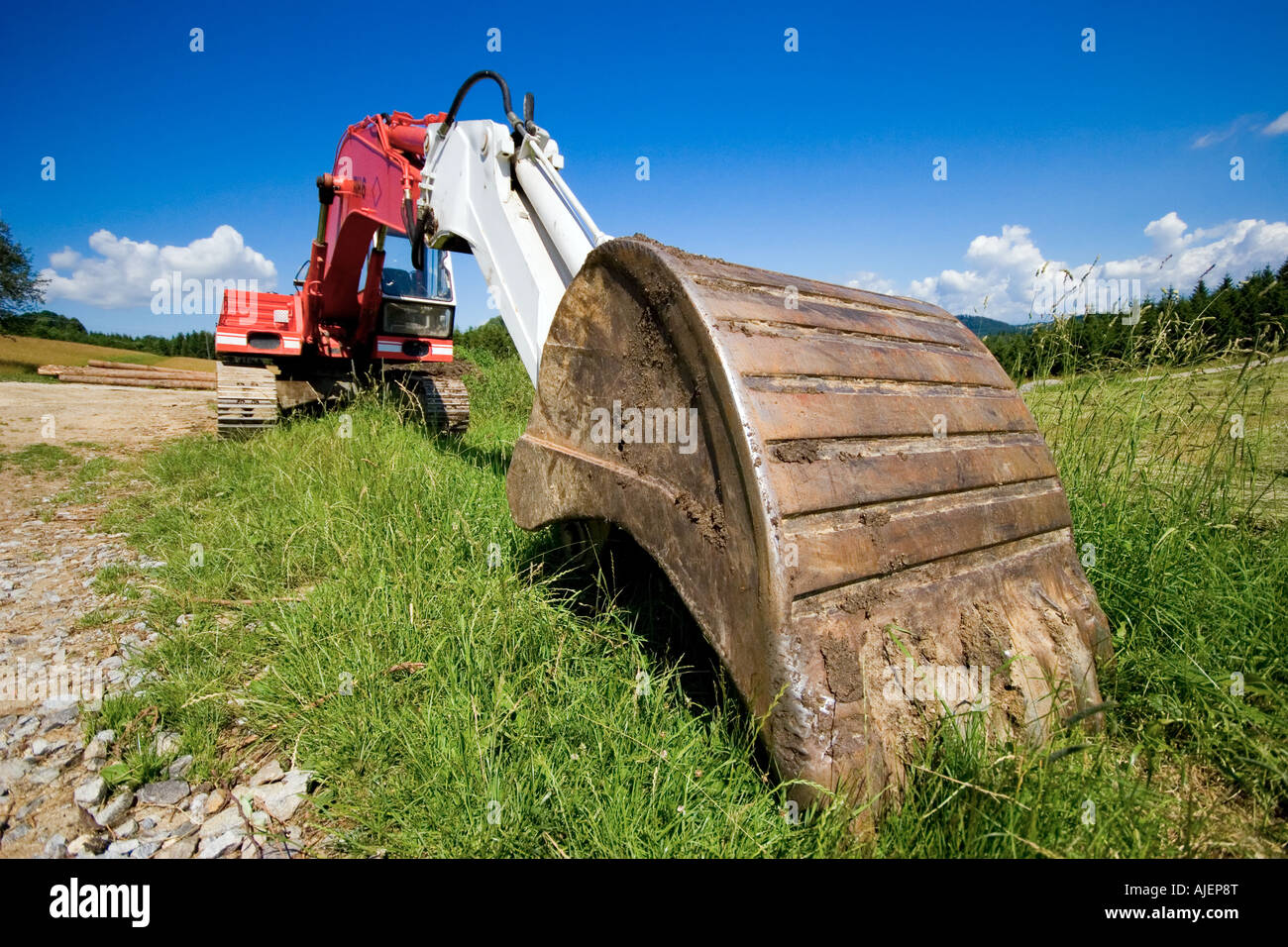 Red digger bulldozer in field Stock Photo - Alamy