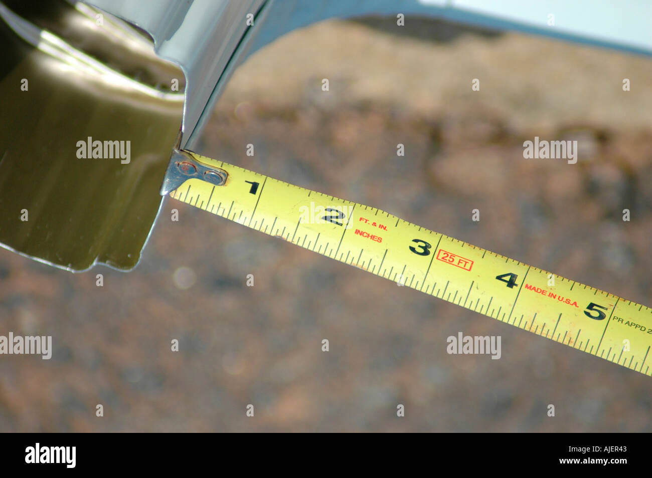 Installation of rain water run off gutters by young men on ladders and ...