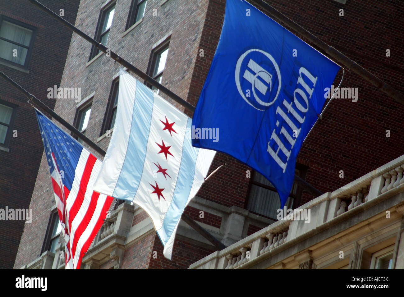 Chicago Illinois Midwest USA flags flying outside Hilton Hotel Stock ...