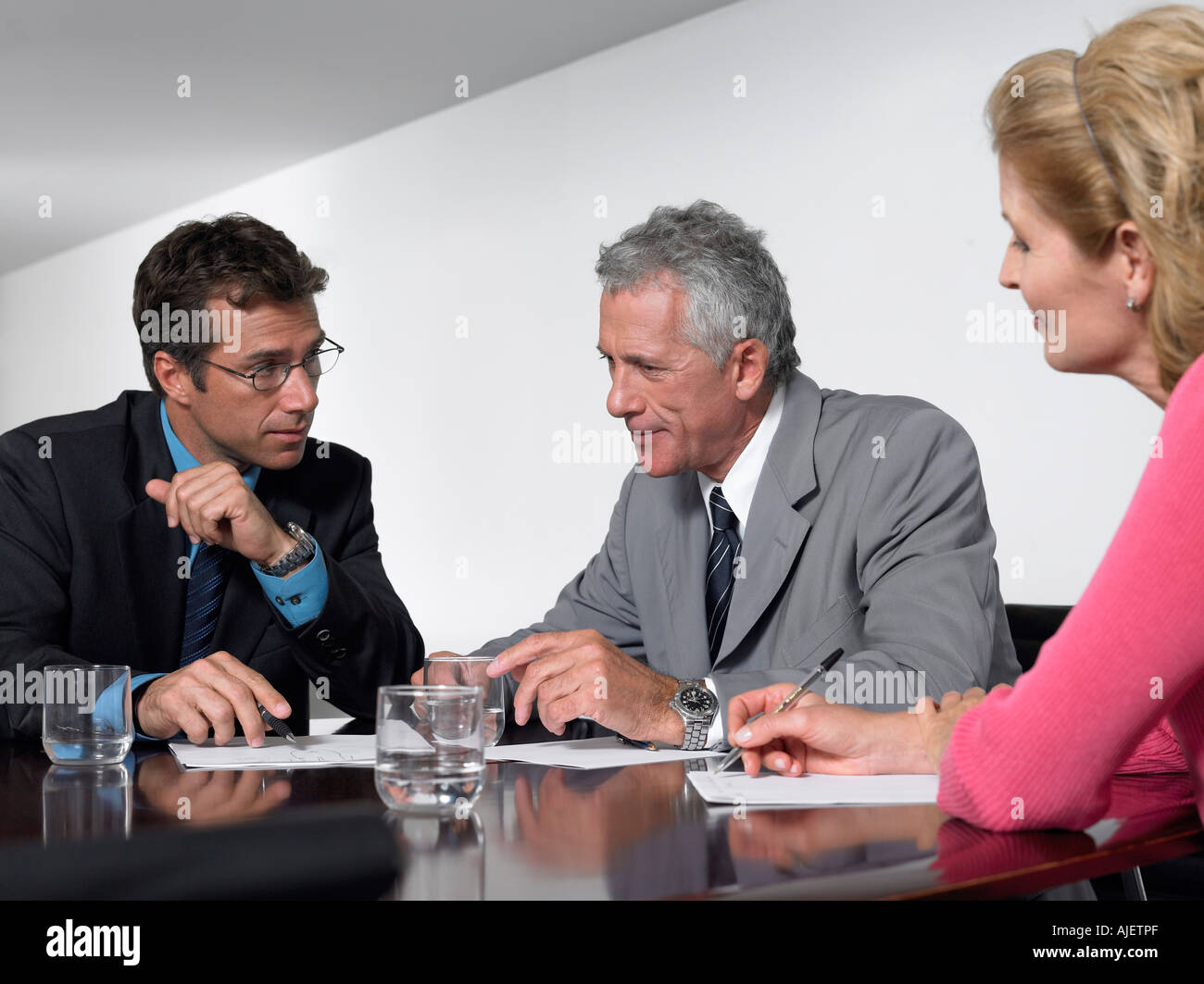 Three business colleagues in conference meeting Stock Photo - Alamy