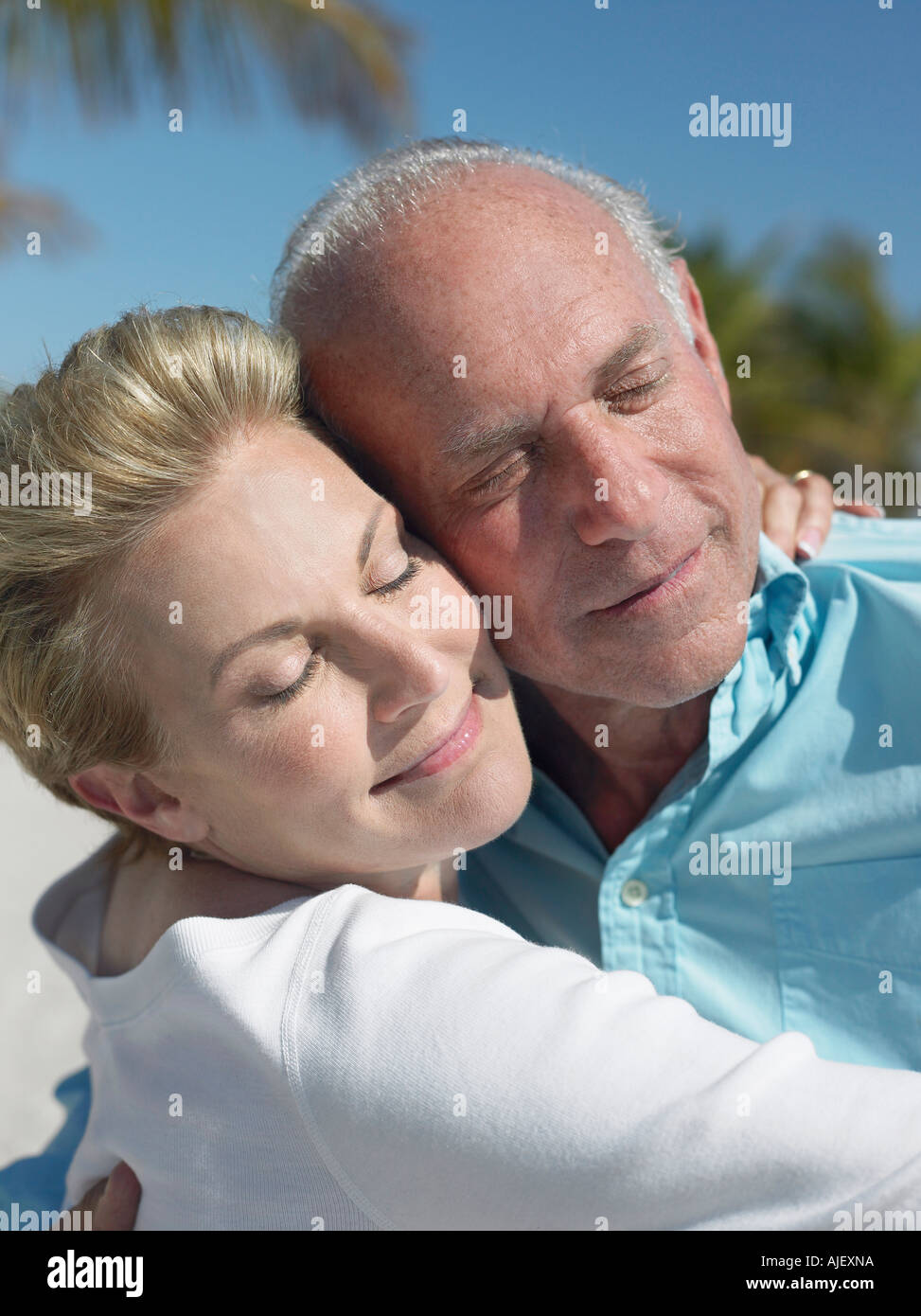 Senior couple cheek to cheek on tropical beach, close up Stock Photo ...