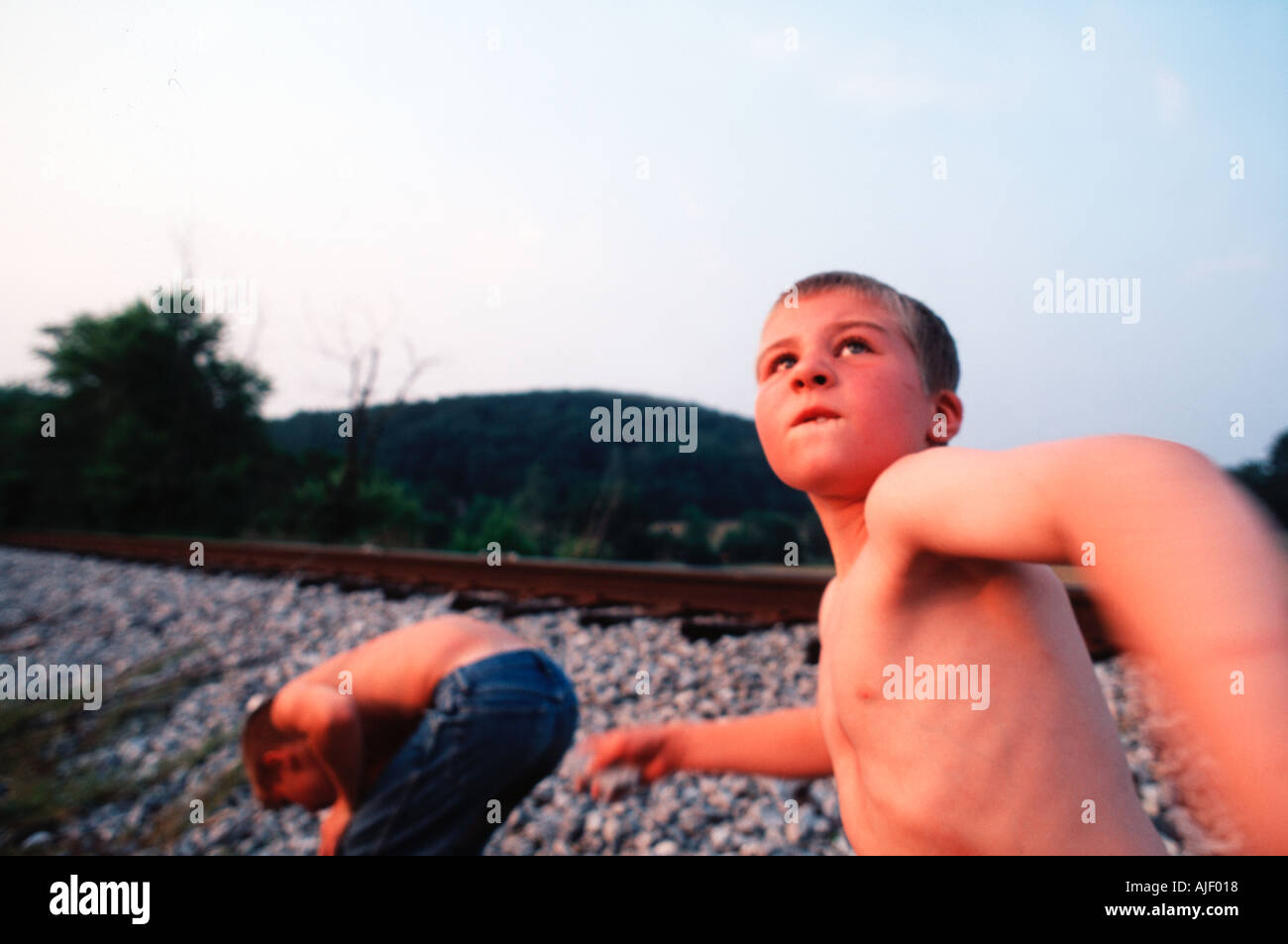 Children throwing rocks hi-res stock photography and images - Alamy