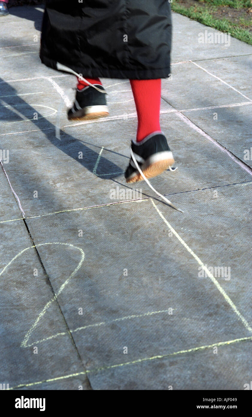 Child hopping hopscotch hi-res stock photography and images - Alamy