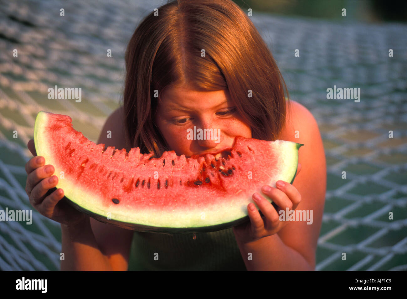 Girls with watermelon slices hi-res stock photography and images - Alamy