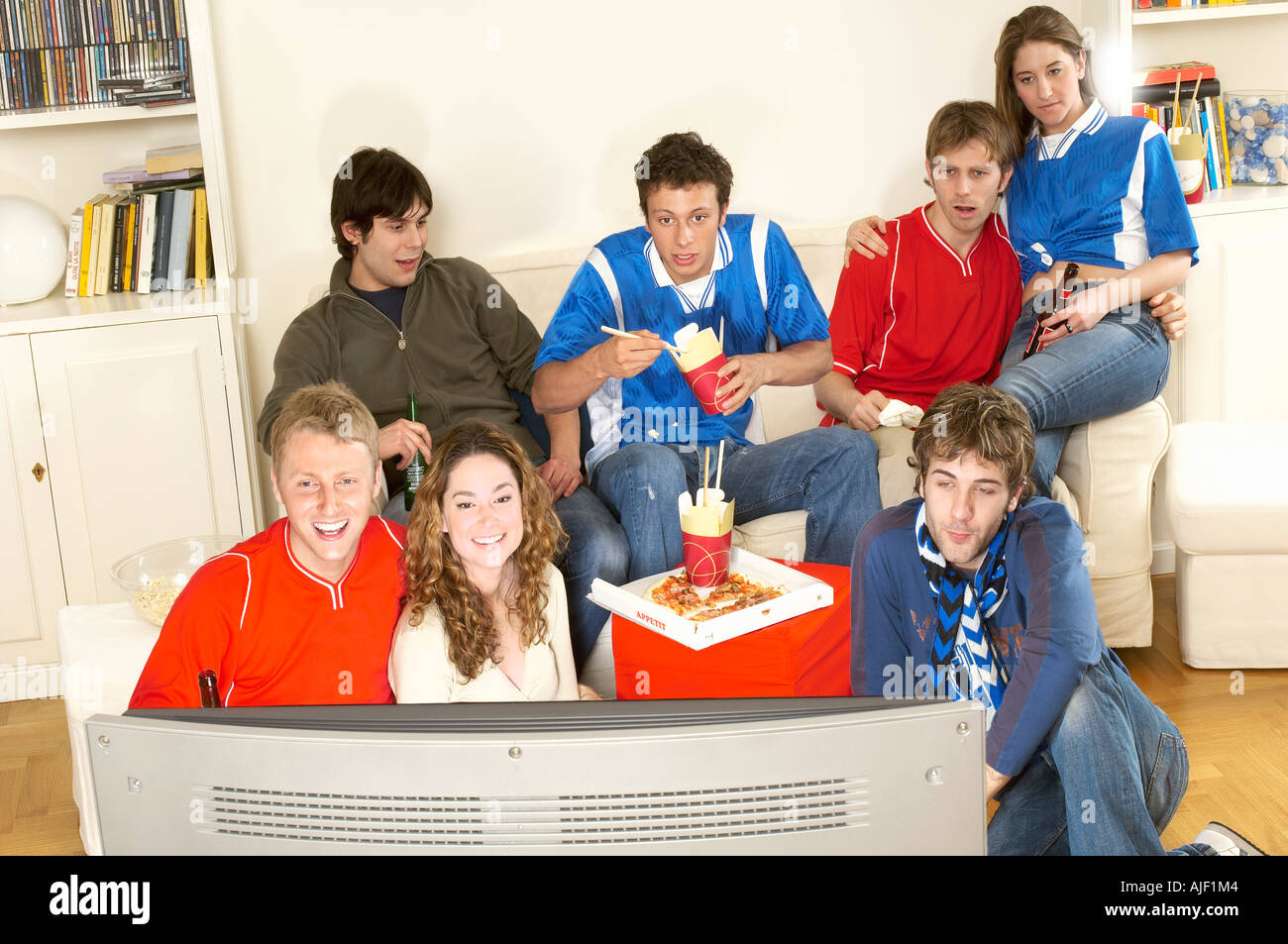 Small group friends watching tv hi-res stock photography and images - Alamy