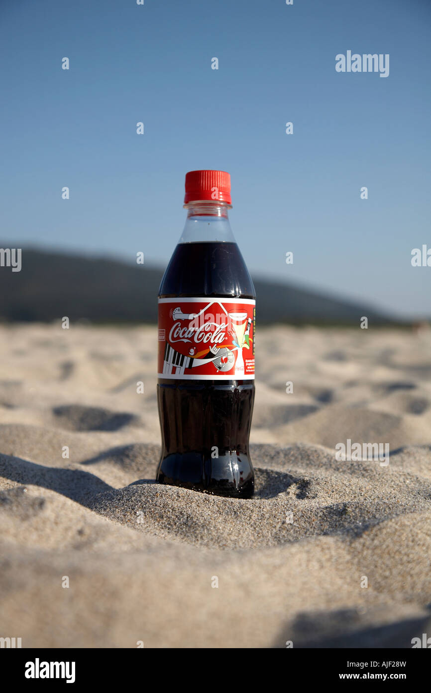 coke on sandy beach Stock Photo - Alamy
