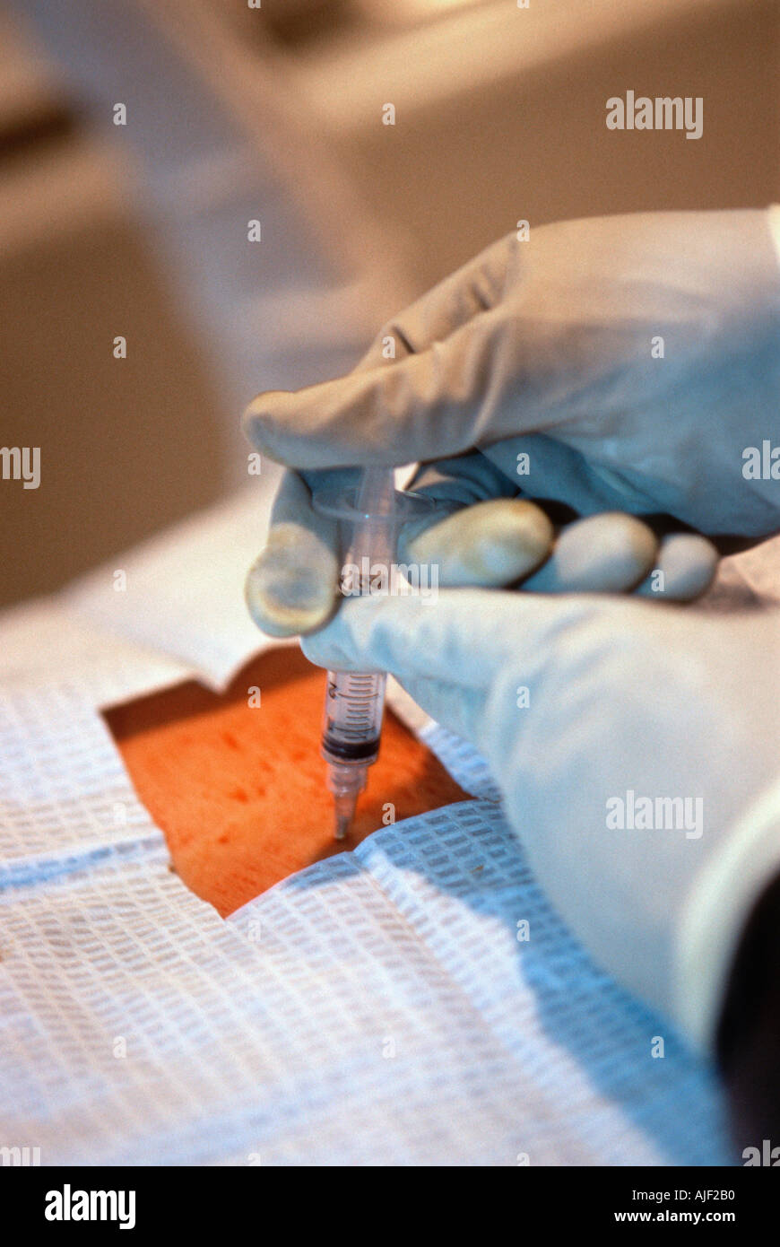 Radiologist administering an injection to a patient in a hospital Stock ...