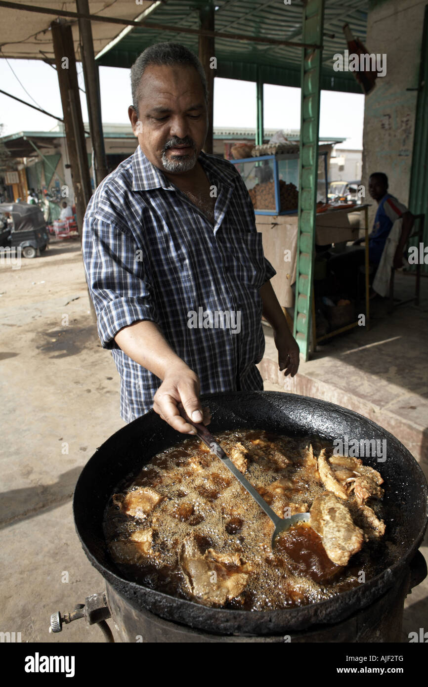Cooking fish in the town of Dongola Stock Photo - Alamy