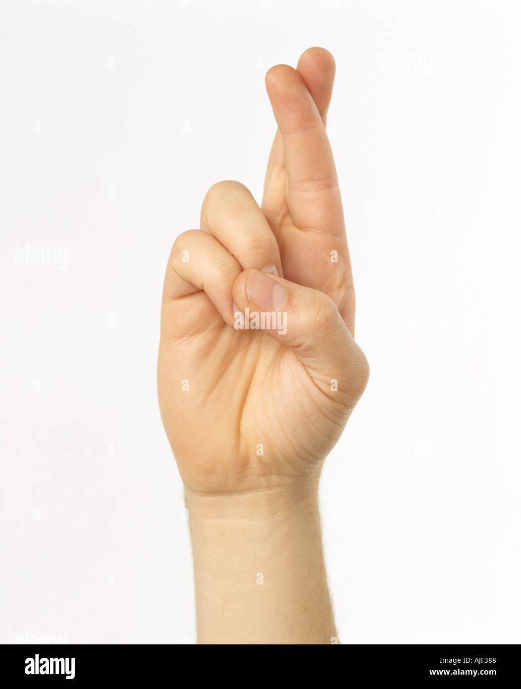 Male hand with fingers crossed Stock Photo - Alamy