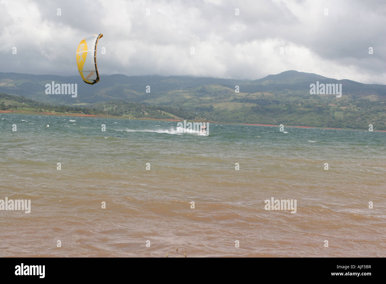 Kite boarding in Costa Rica lake Arenal Stock Photo - Alamy