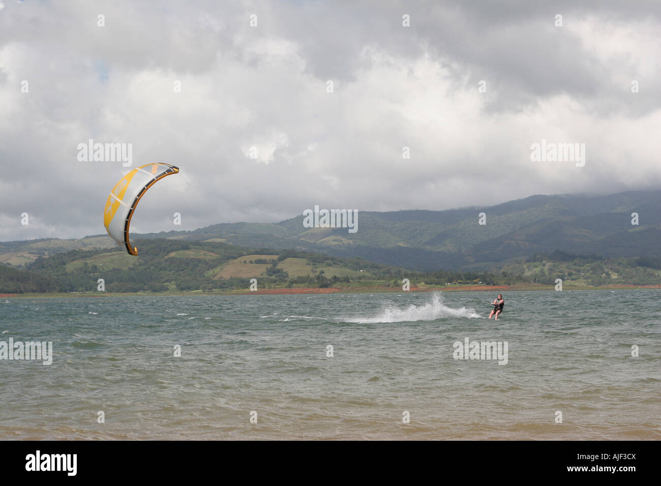 Kite boarding in Costa Rica lake Arenal Stock Photo - Alamy