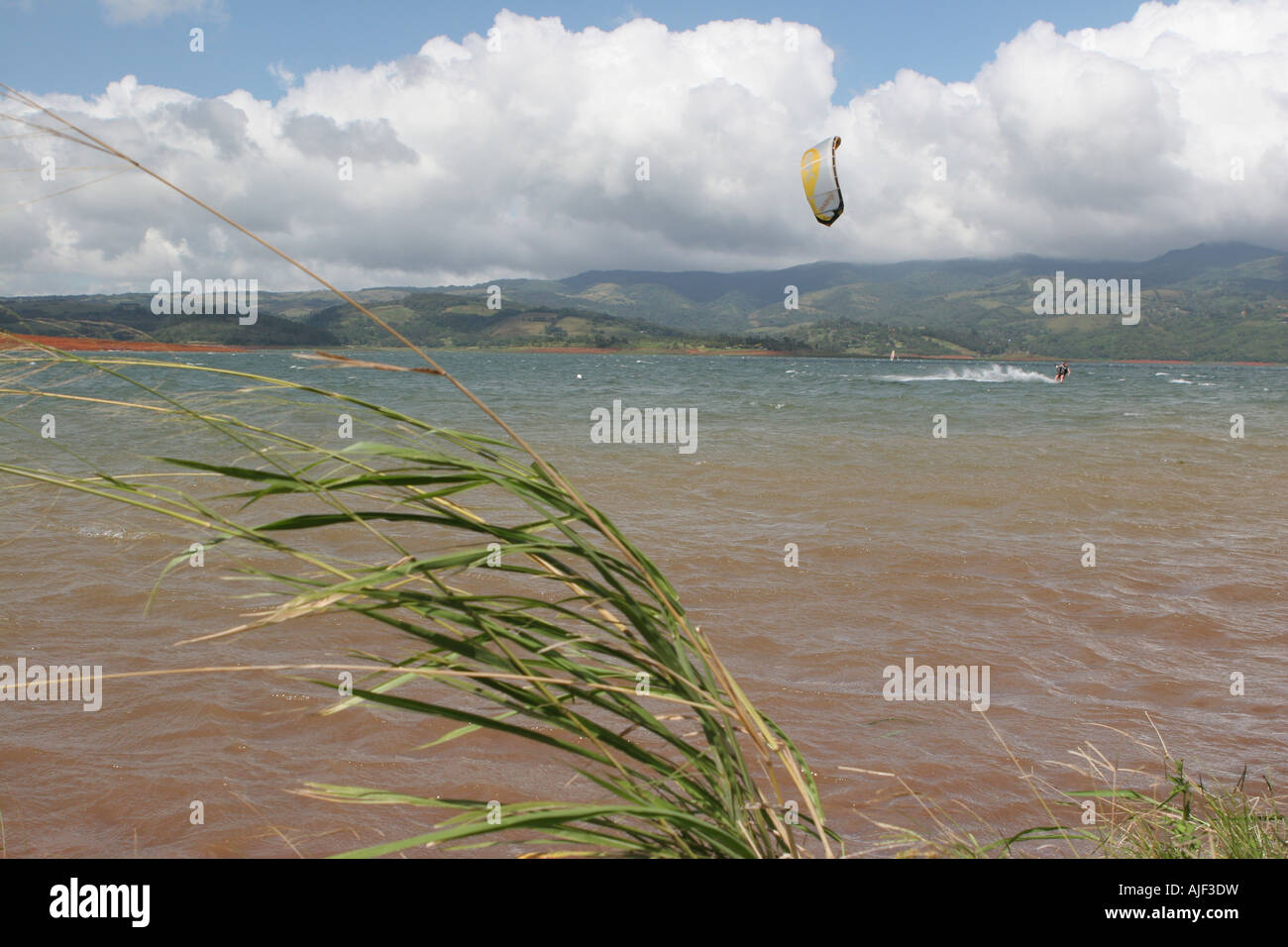 Kite boarding in Costa Rica lake Arenal Stock Photo - Alamy