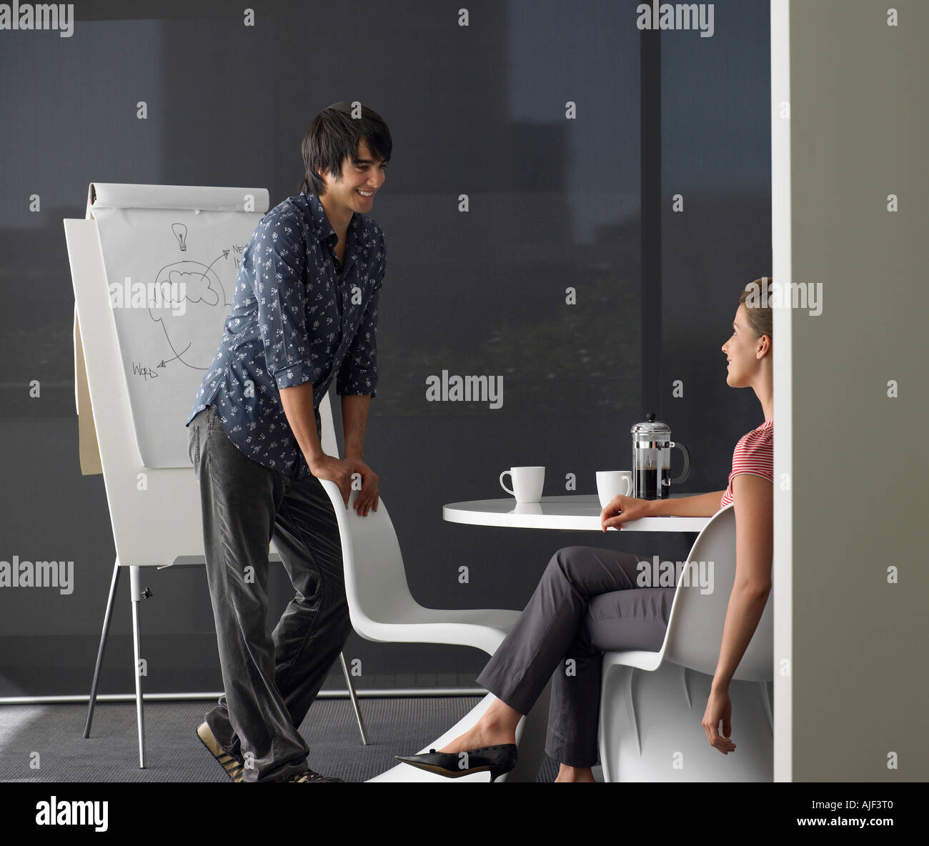 Business man giving presentation on flipchart Stock Photo - Alamy