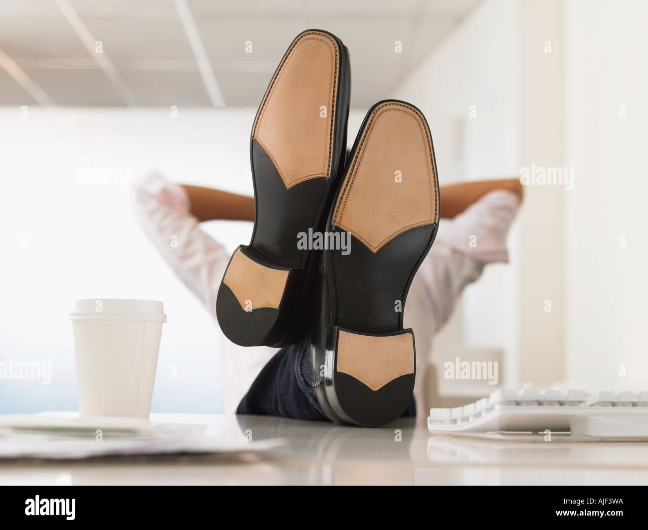 Feet up on desk hi-res stock photography and images - Alamy