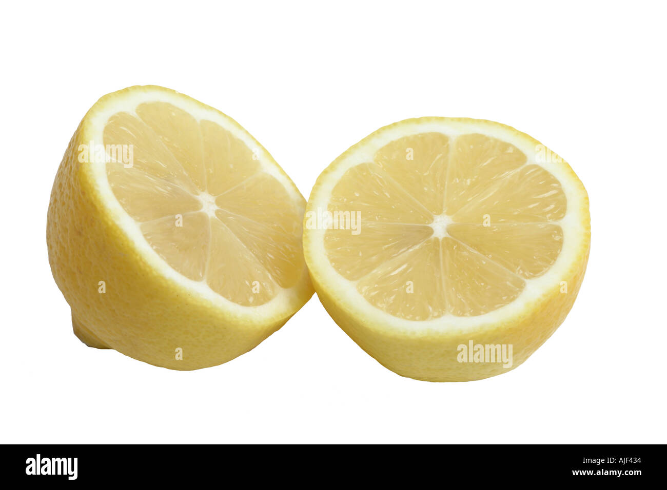 Lemon cut into two halves on a white background Stock Photo - Alamy