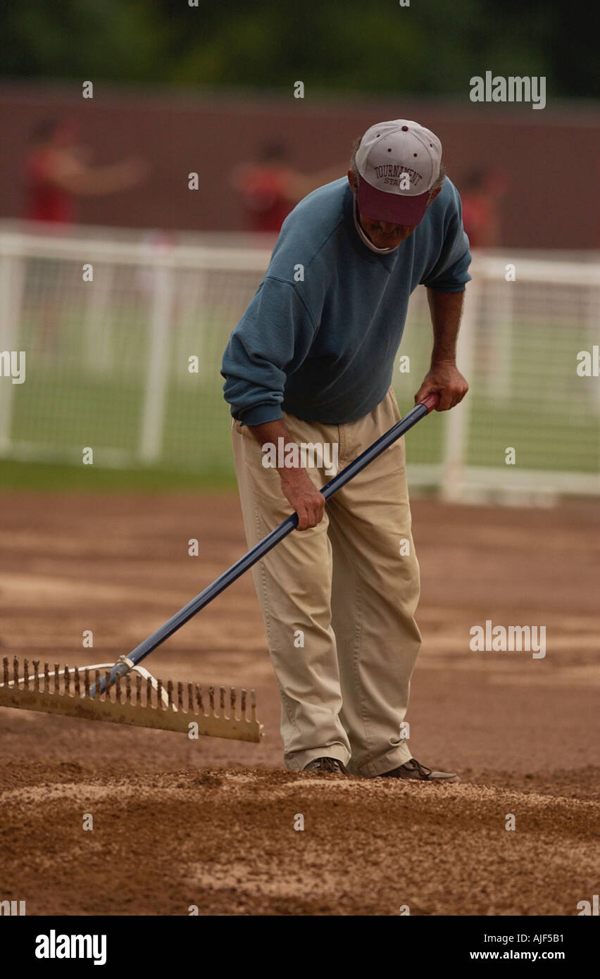 Field crew does maintenance to the baseball field between games Stock ...