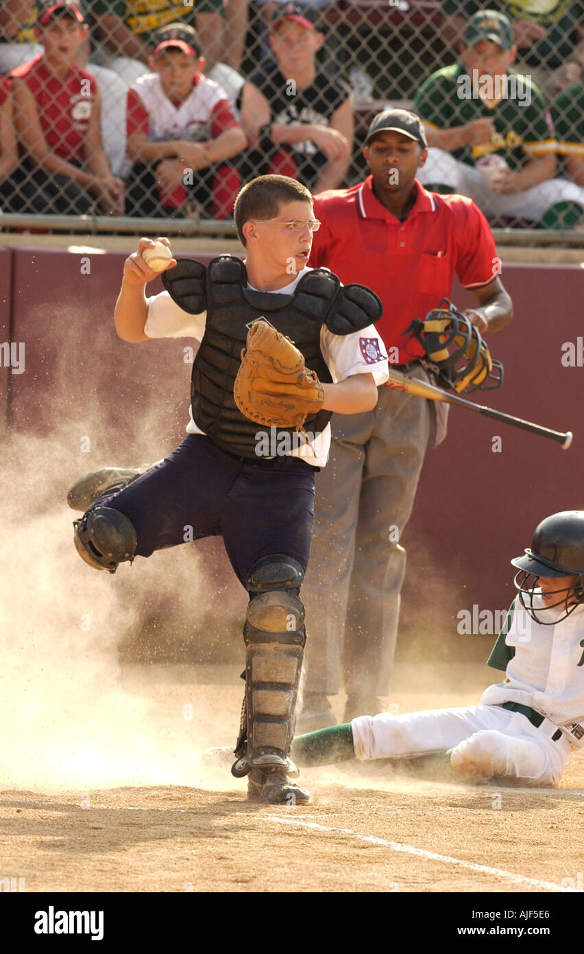 Youth baseball game action Stock Photo - Alamy
