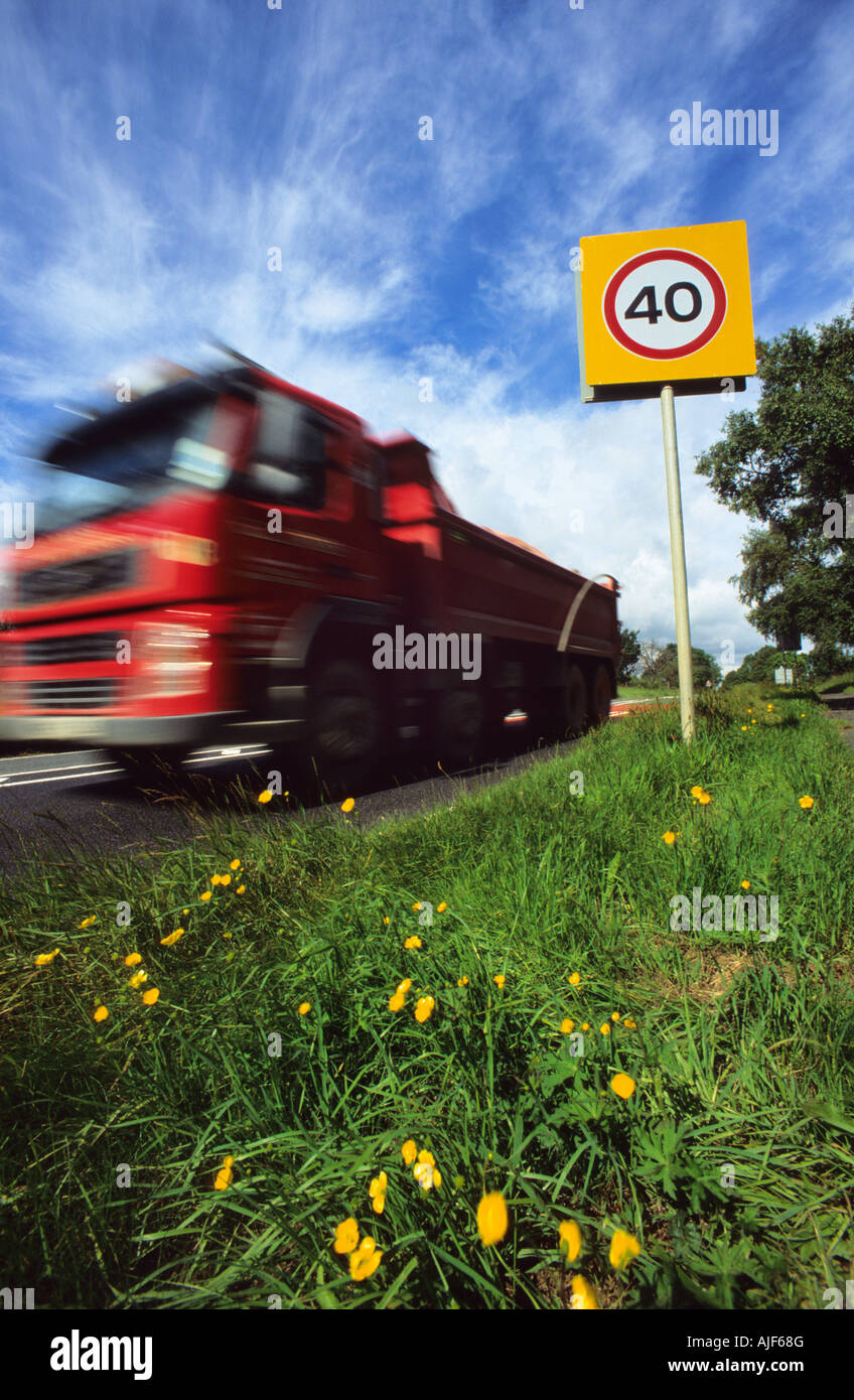 lorry passing 40 miles per hour speed limit warning sign on country ...
