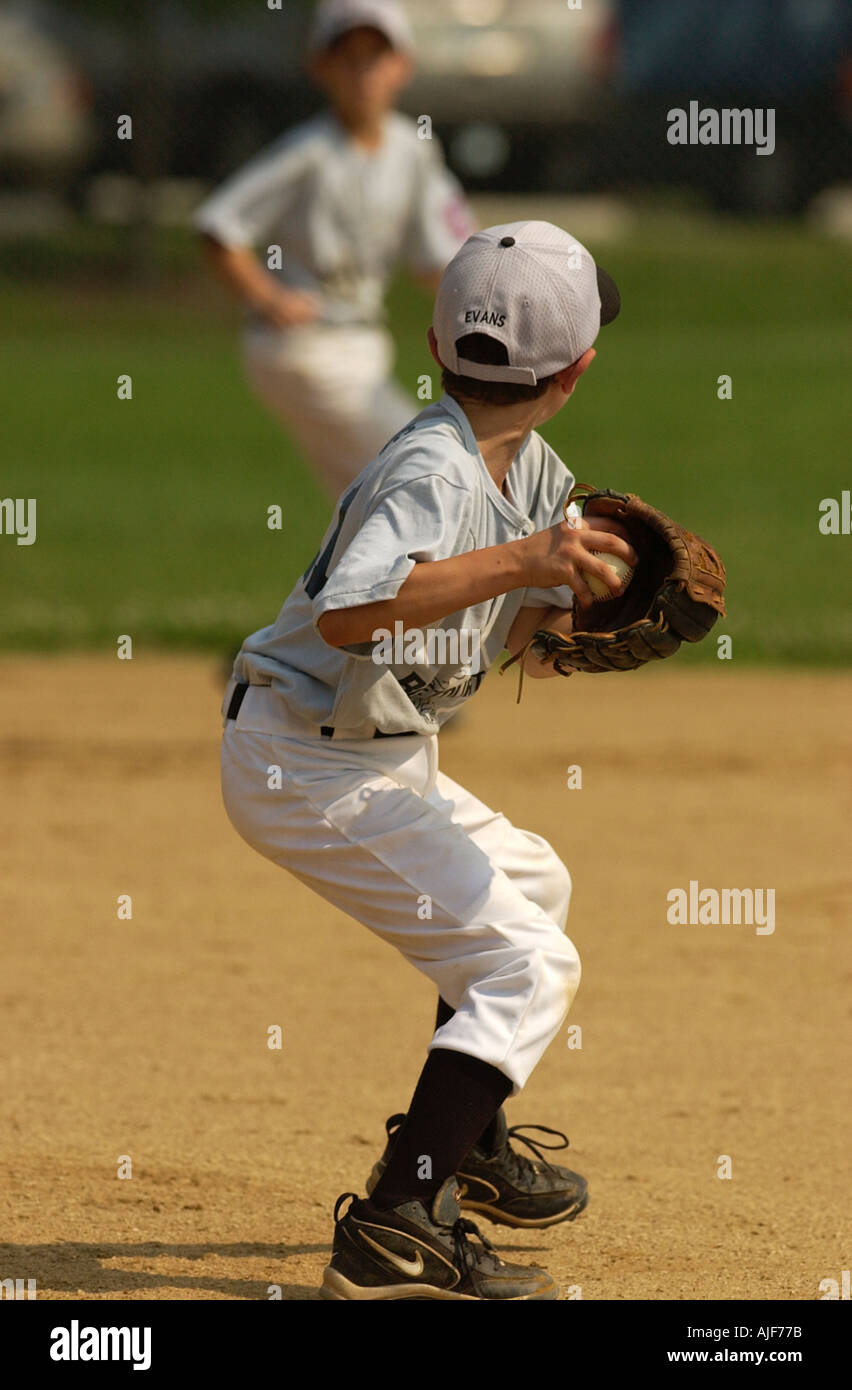 Youth baseball game action Stock Photo - Alamy
