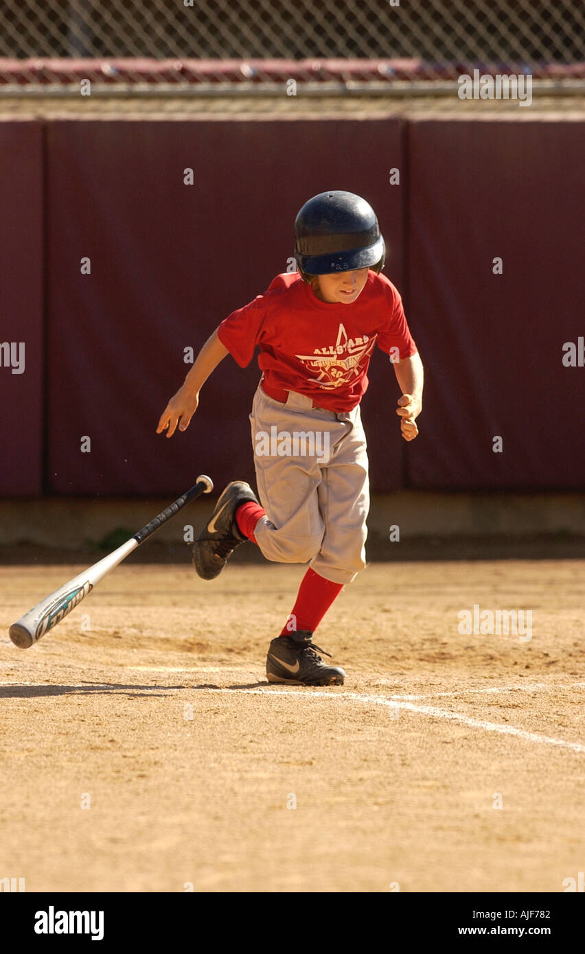Youth baseball game action Stock Photo - Alamy