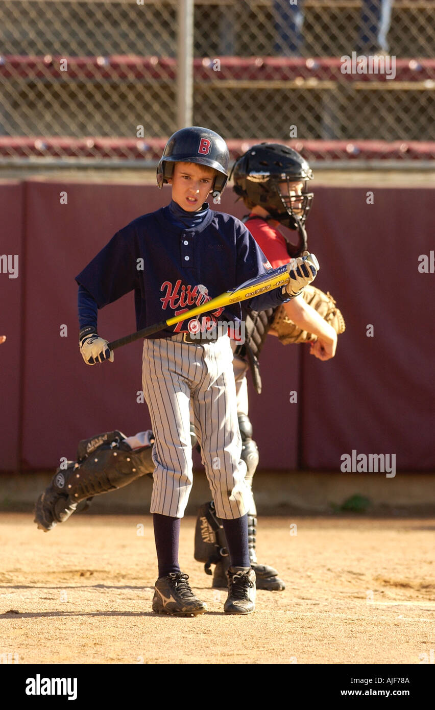 Youth baseball game action Stock Photo - Alamy
