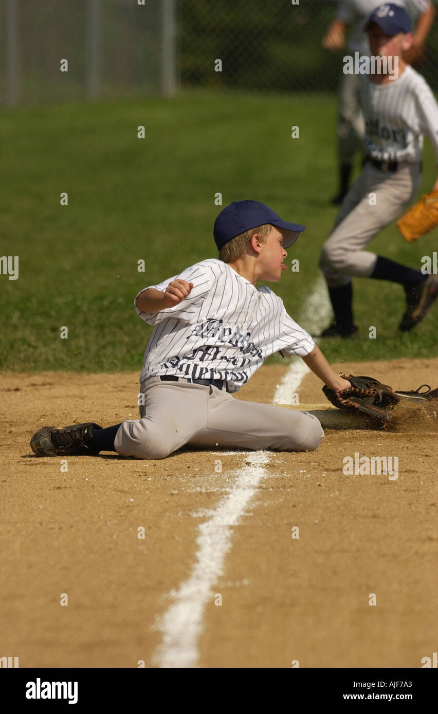 Youth baseball game action Stock Photo - Alamy